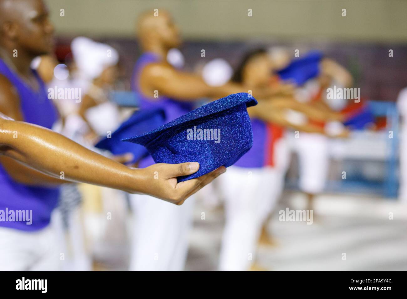 man holding hat during carnival rehearsal in Rio de Janeiro, Brazil ...