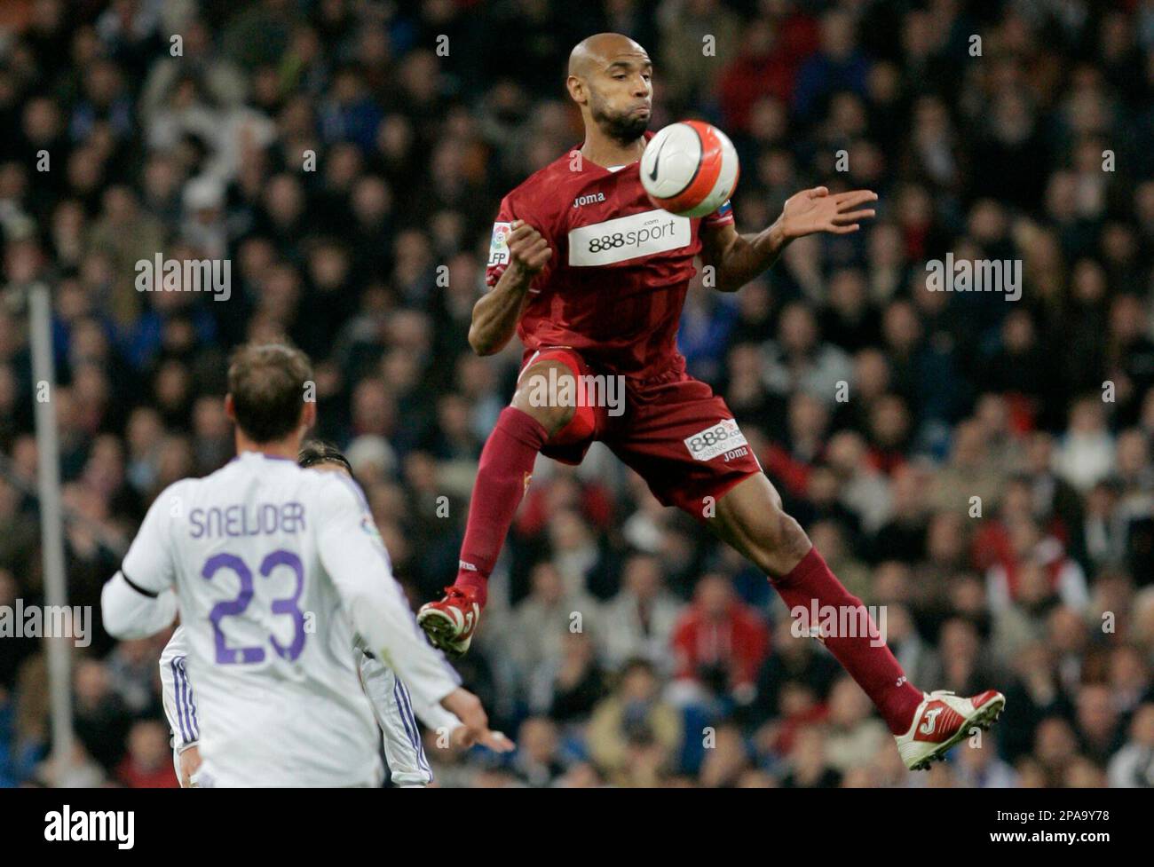 Sevilla player Frederic Kanoute, from Mali, jumps for the ball against ...