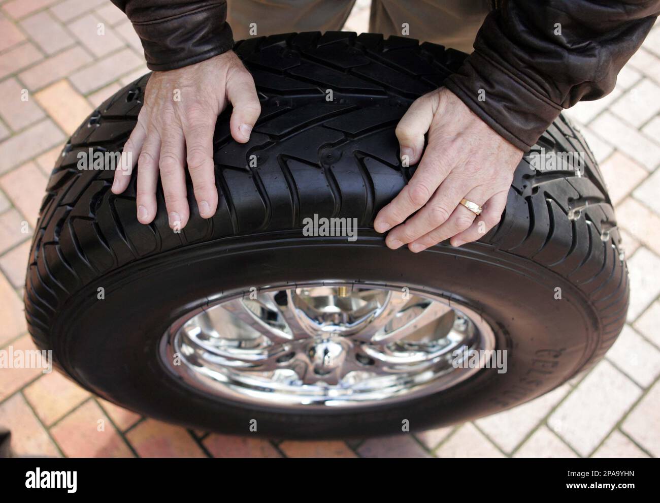 Michael O'Brien, founder of Q Tires, is shown next to a Q Tire Tuesday ...
