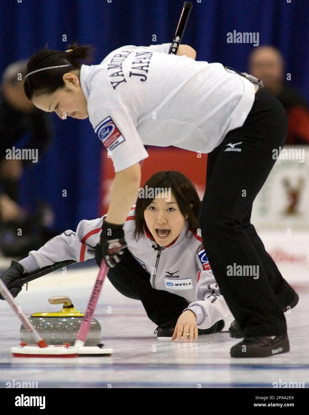Team Japan's skip Moe Meguro, bottom, keep her eye on her rock as ...