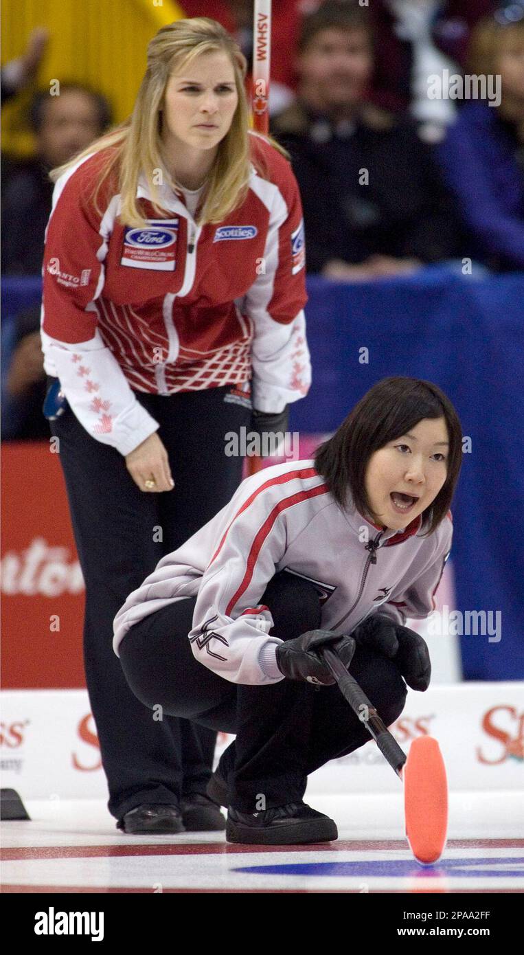Team Canada's skip Jennifer Jones looks over the shoulder of Team Japan ...