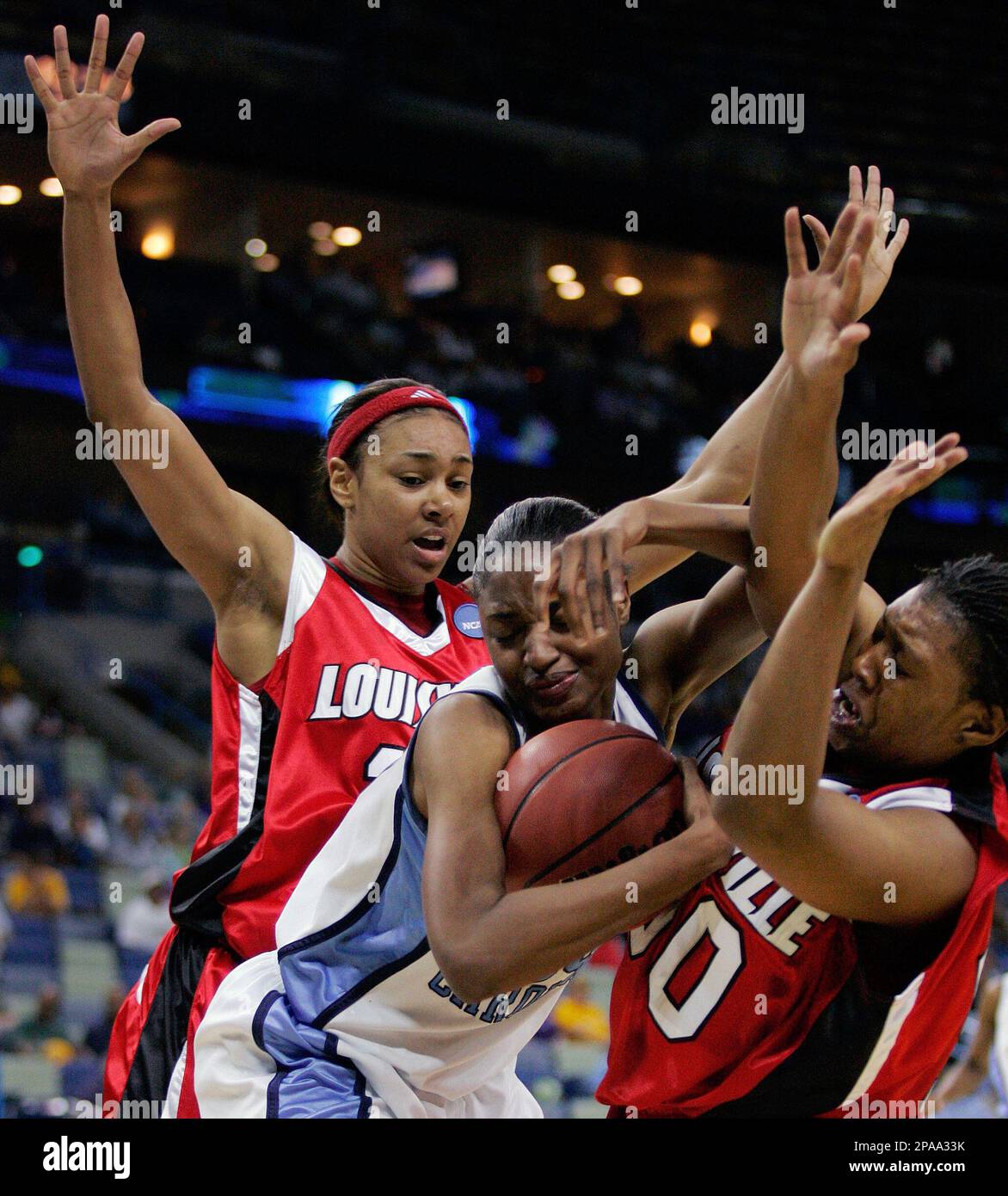 North Carolina forward LaToya Pringle (30) fights off Louisville guard ...