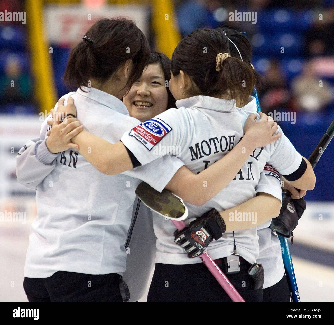 Japan skip Moe Meguro, center, celebrates with teammates, third Mari ...