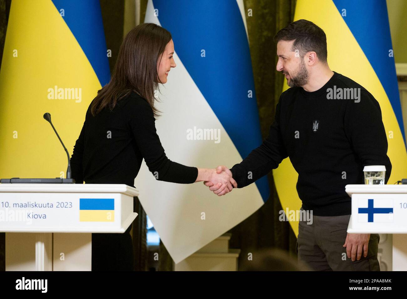Kyiv, Ukraine. 10th Mar, 2023. Finnish Prime Minister Sanna Marin, left, shakes hands with ...