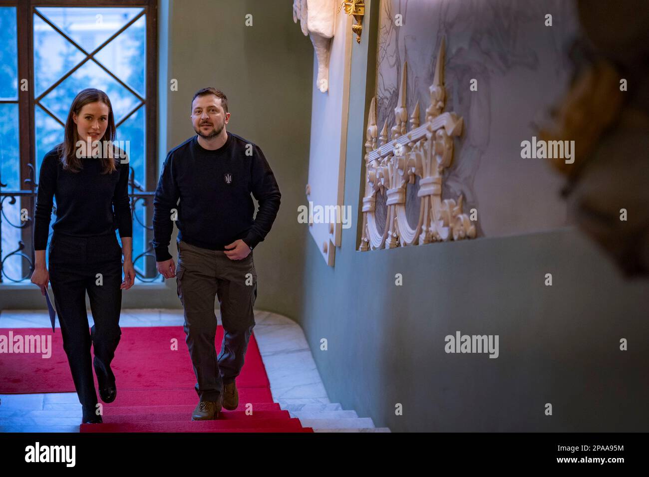 Kyiv, Ukraine. 10th Mar, 2023. Finnish Prime Minister Sanna Marin, left, is escorted by ...