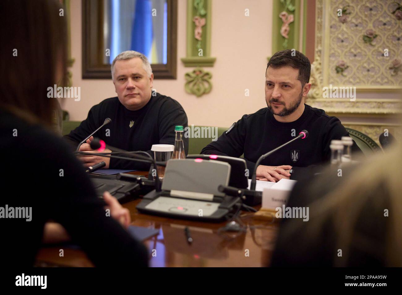 Kyiv, Ukraine. 10th Mar, 2023. Ukrainian President Volodymyr Zelenskyy, right, listens during an ...