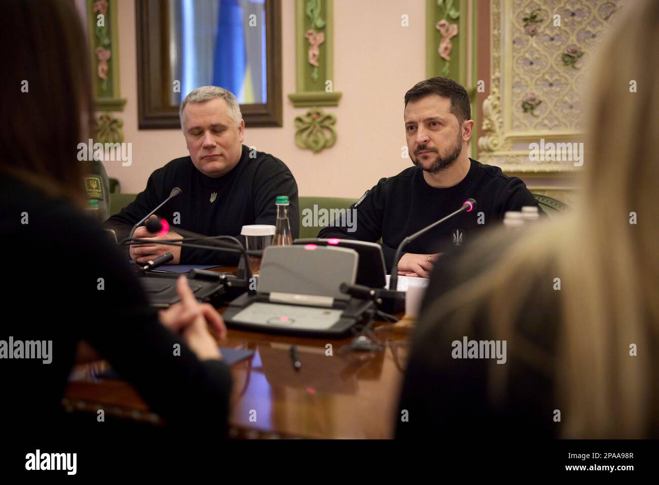 Kyiv, Ukraine. 10th Mar, 2023. Ukrainian President Volodymyr Zelenskyy, right, listens during an ...
