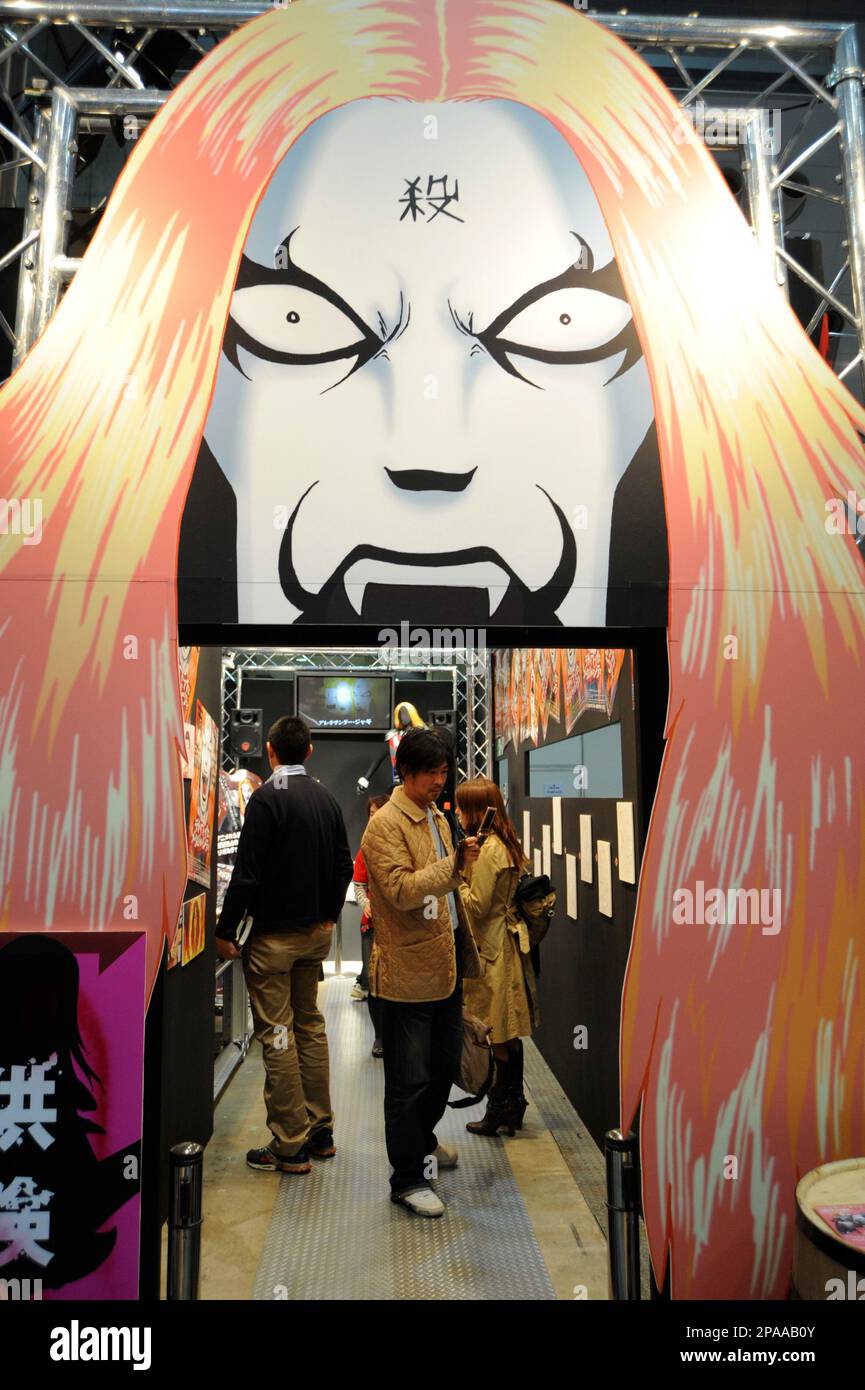 Visitors to the Tokyo International Anime Fair 2008 look at popular ...
