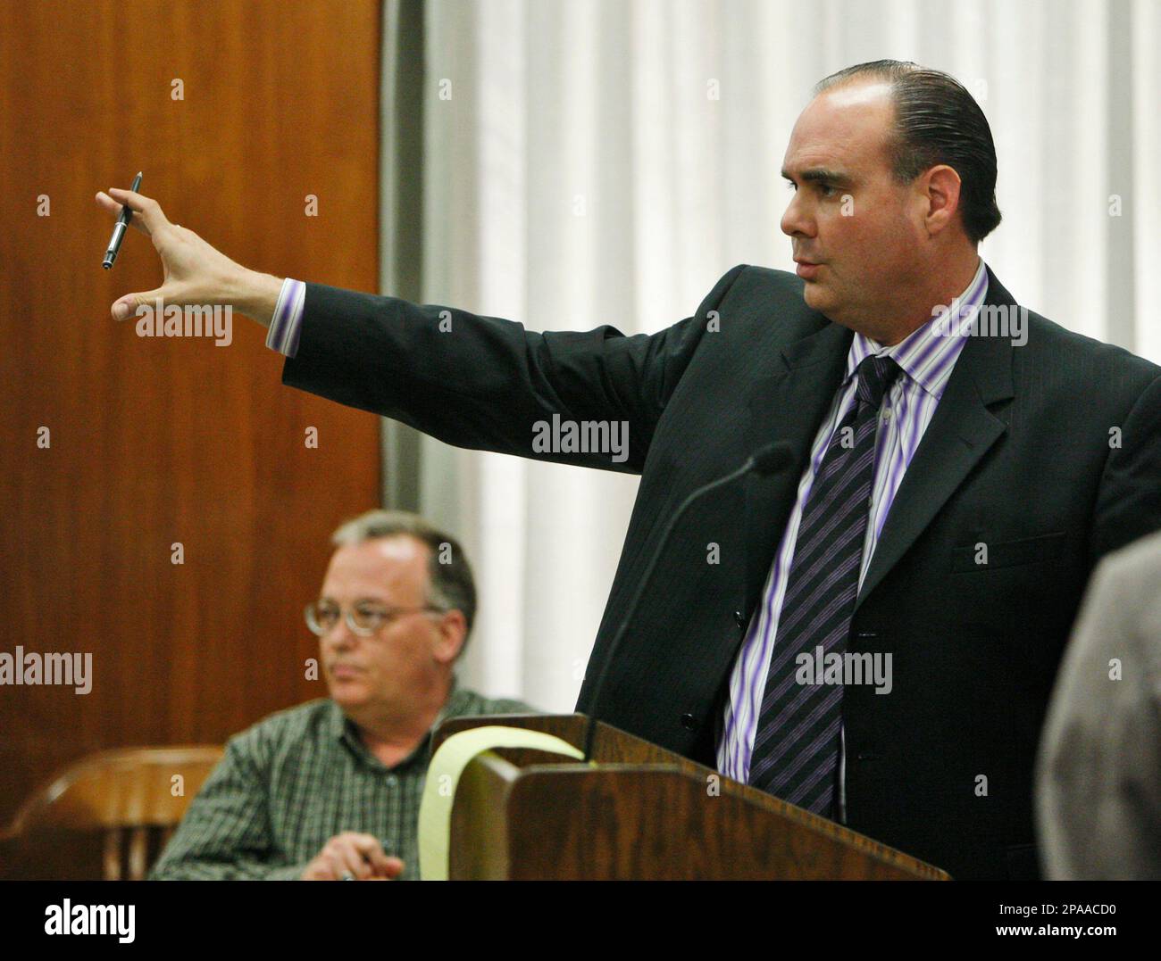 Allen Beckett, left, listens as his attorney, Billy Bock, right ...