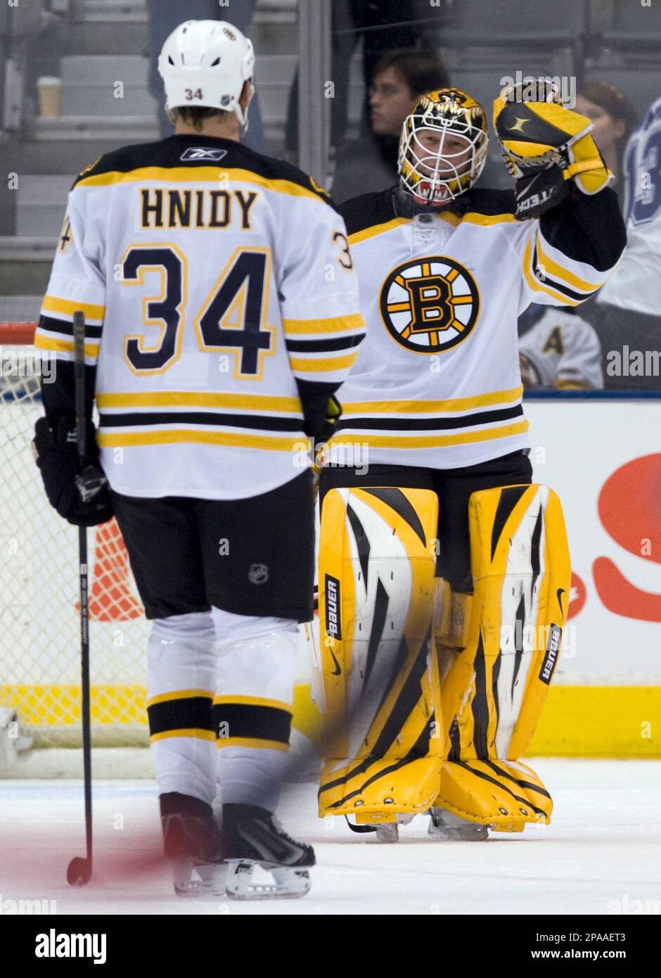 Boston Bruins goaltender Tim Thomas celebrates with defenceman Shane ...