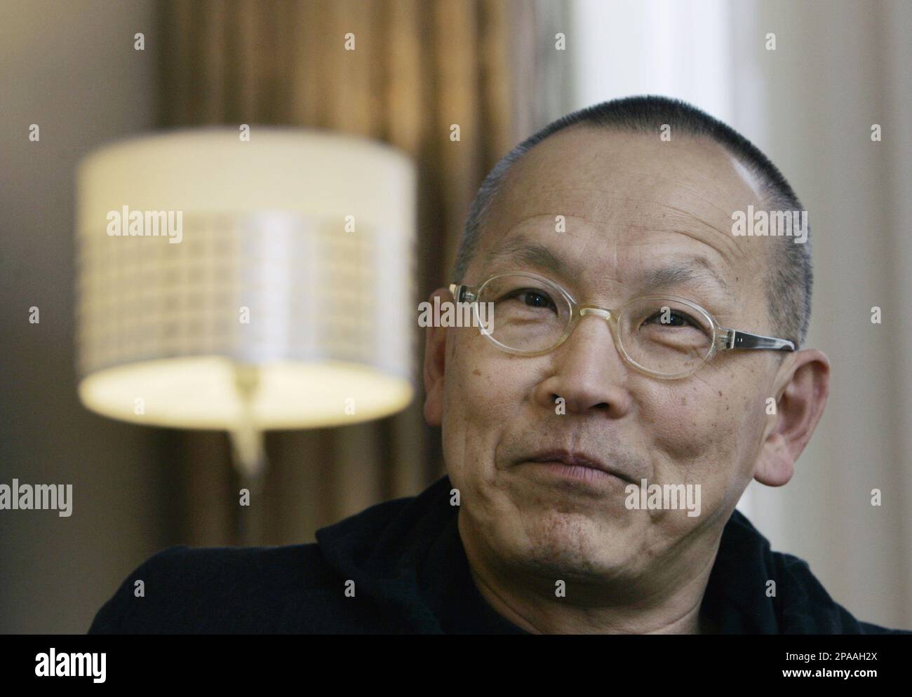 Chinese-American director Wayne Wang looks on during an interview in ...