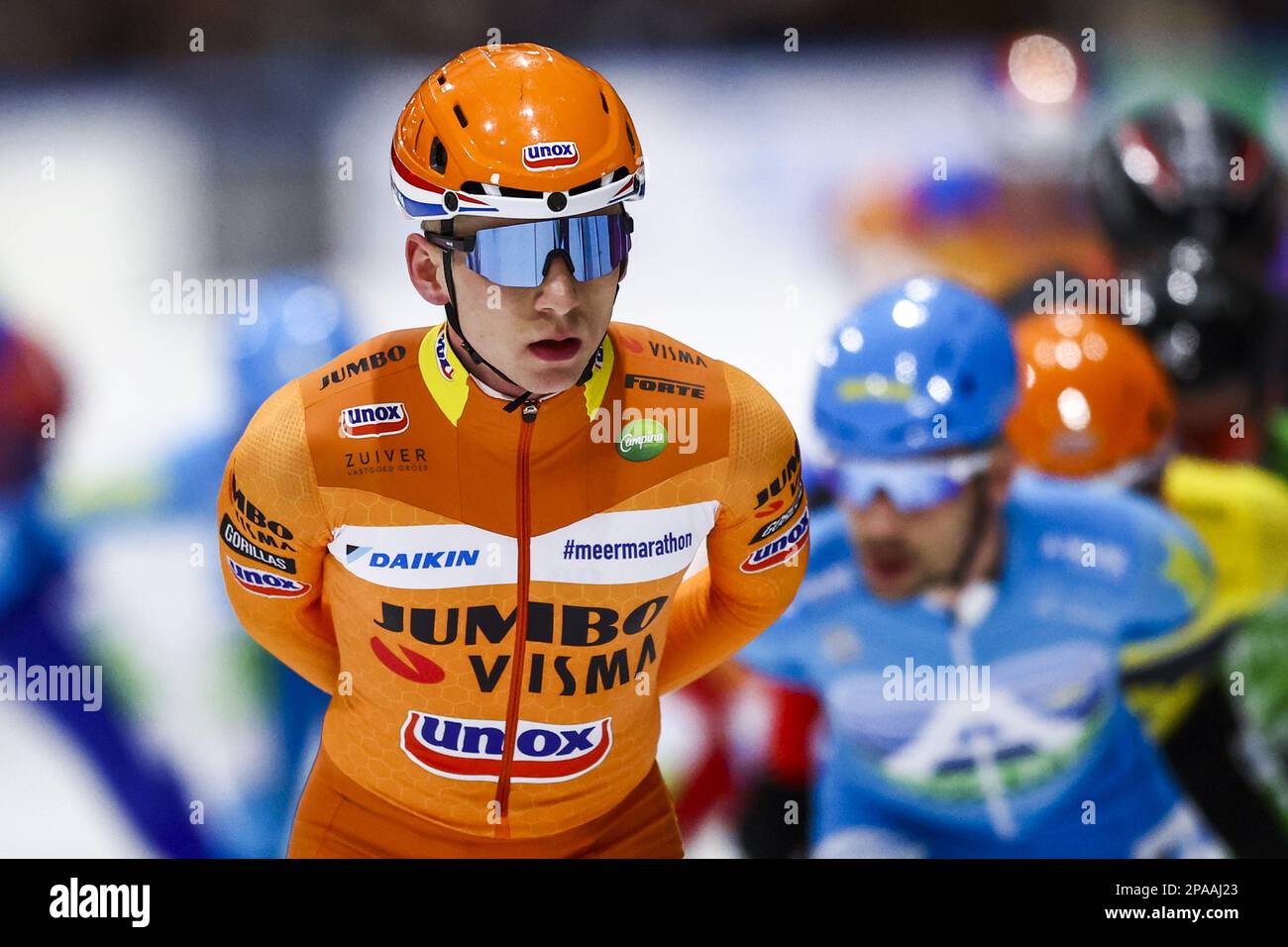 LEEUWARDEN - Harm Visser in the orange leader's suit, Sjoerd den Hertog ...