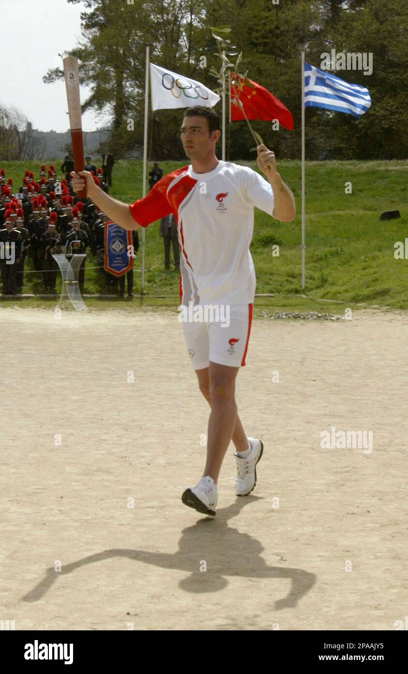 The first torchbearer in the Beijing Olympic flame relay, Greek ...