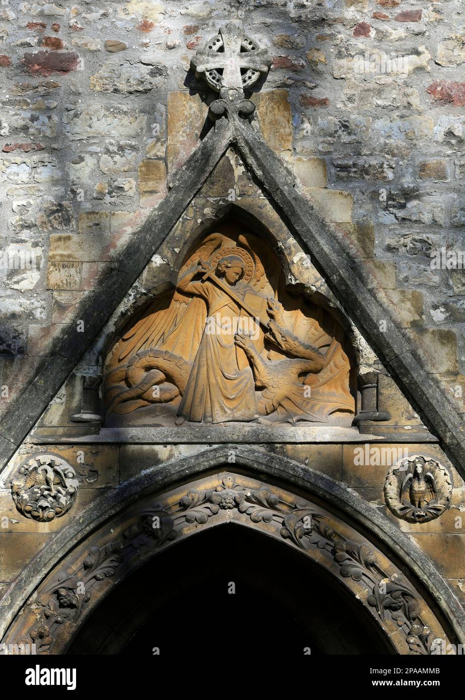 St George slaying the dragon carving over a door at Llandaff Cathedral ...