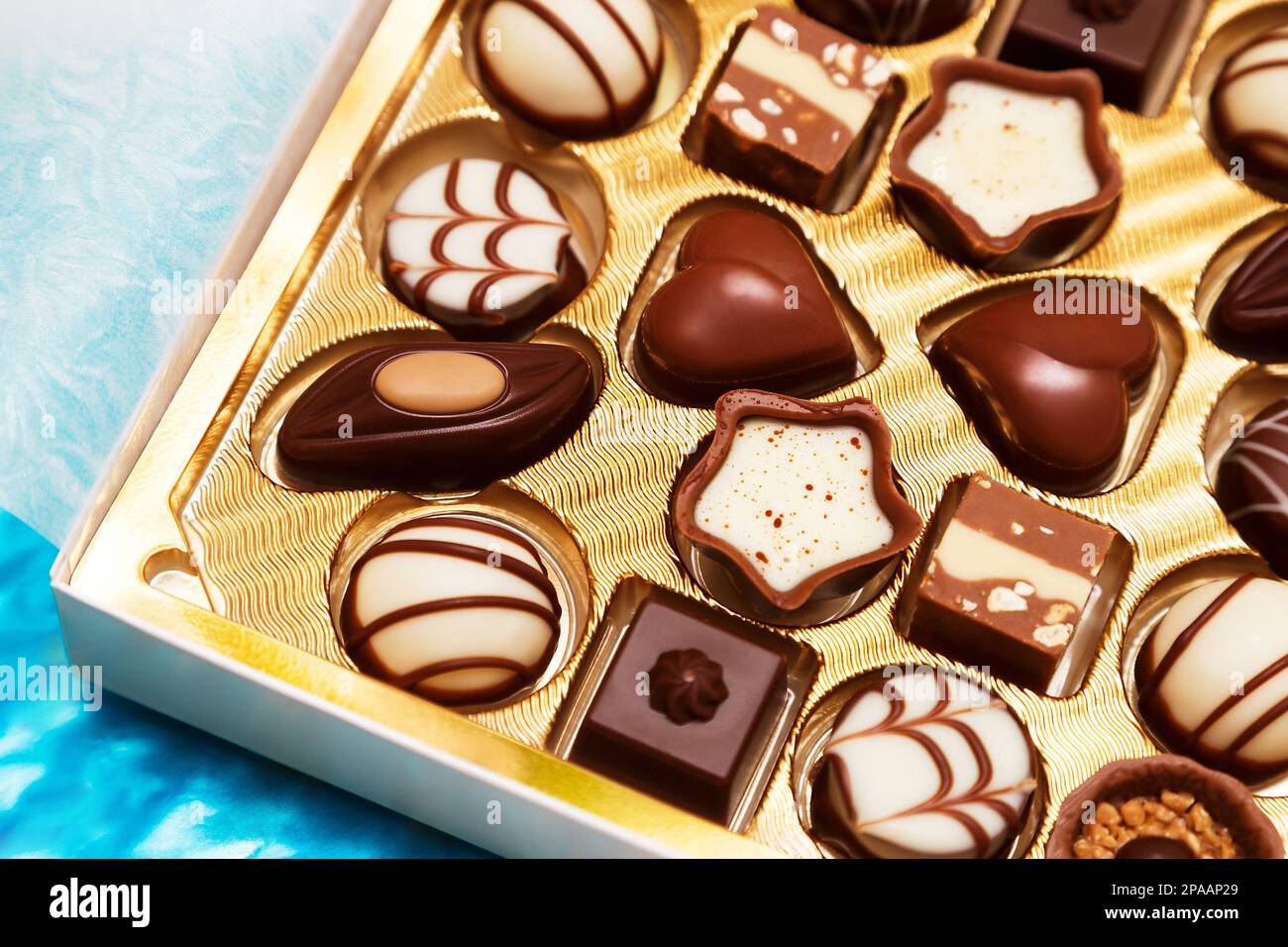 Close up of open small gift box of Swiss chocolate candies. Luxurious ...