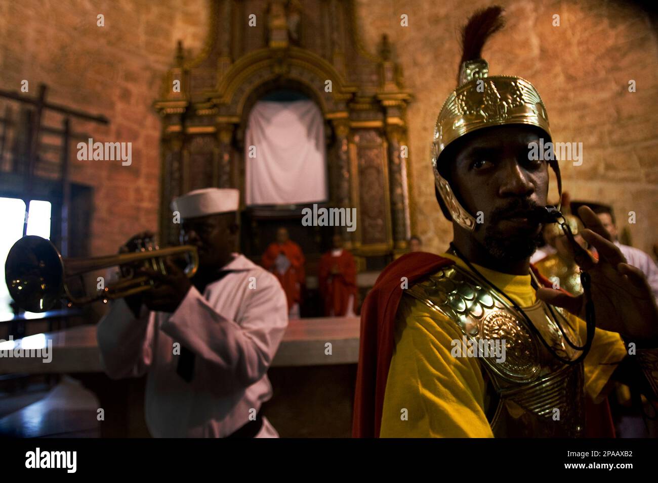 A navy sailor and a man dressed as a Roman soldier participate in a ...