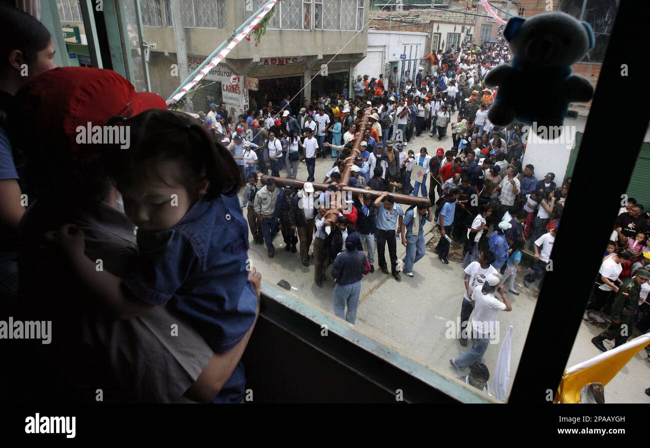 People look at a Holy Week procession in Ciudad Bolivar, south of ...