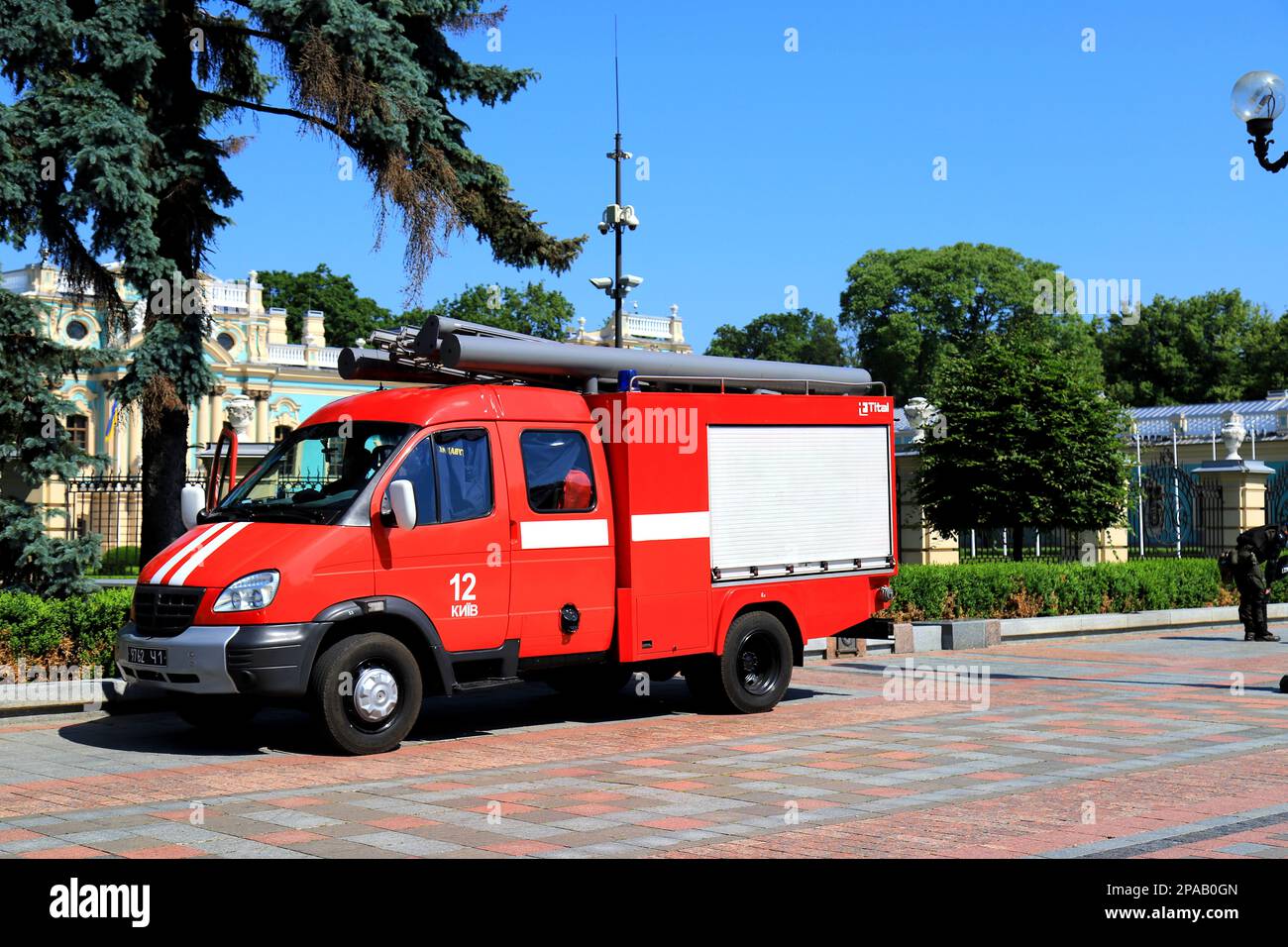 red fire rescue vehicle stands in Kyiv street. Firefighters and ...