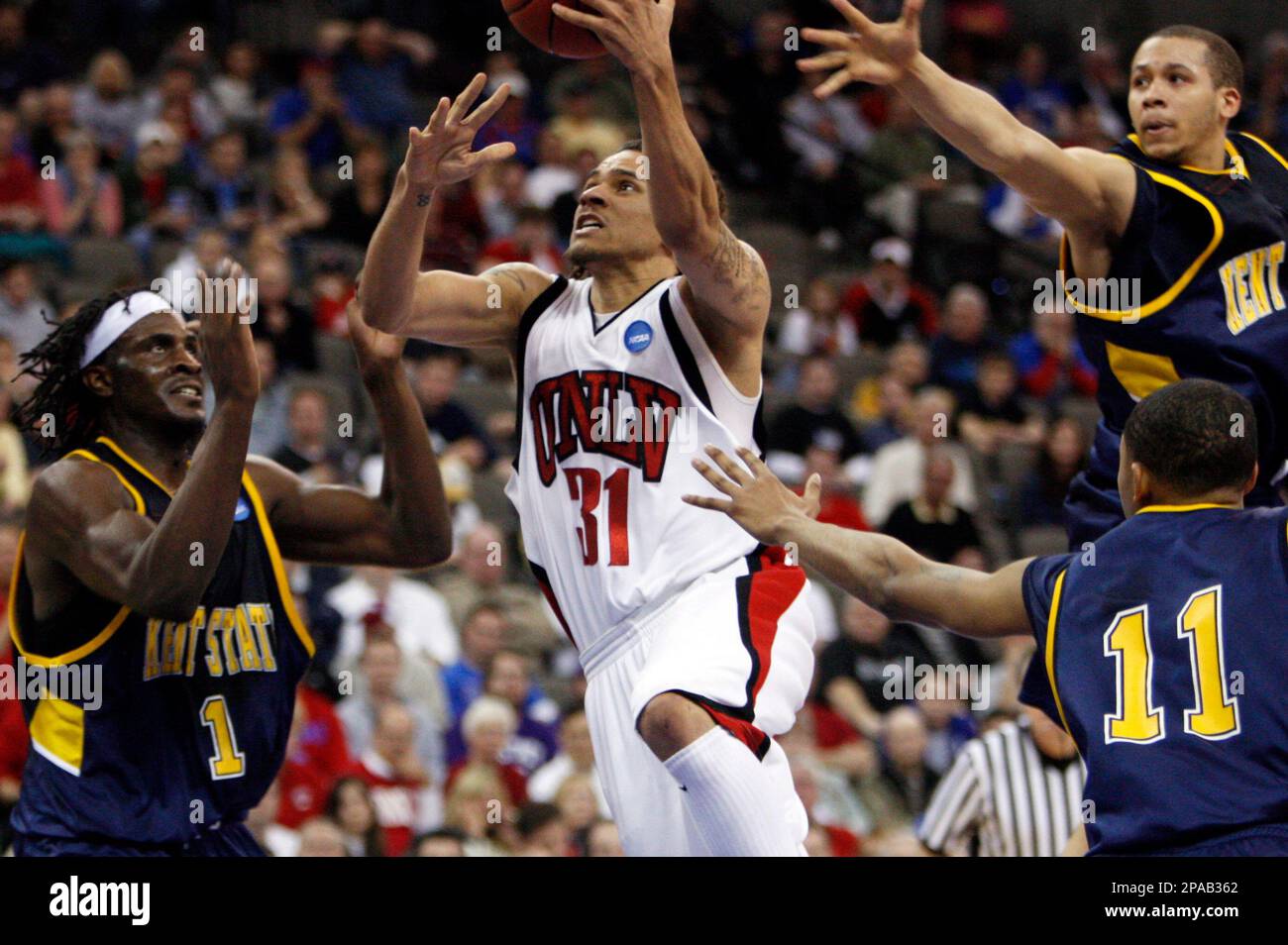 UNLV guard Curtis Terry (31) drives to the basket between Kent State ...
