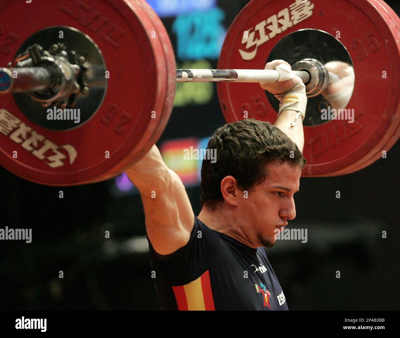 Spain's Isaac Morillas lifts weights during the men's 69 kg class at ...