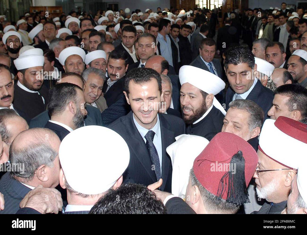 Syria's President Bashar Assad is seen among Syrian religious leaders ...