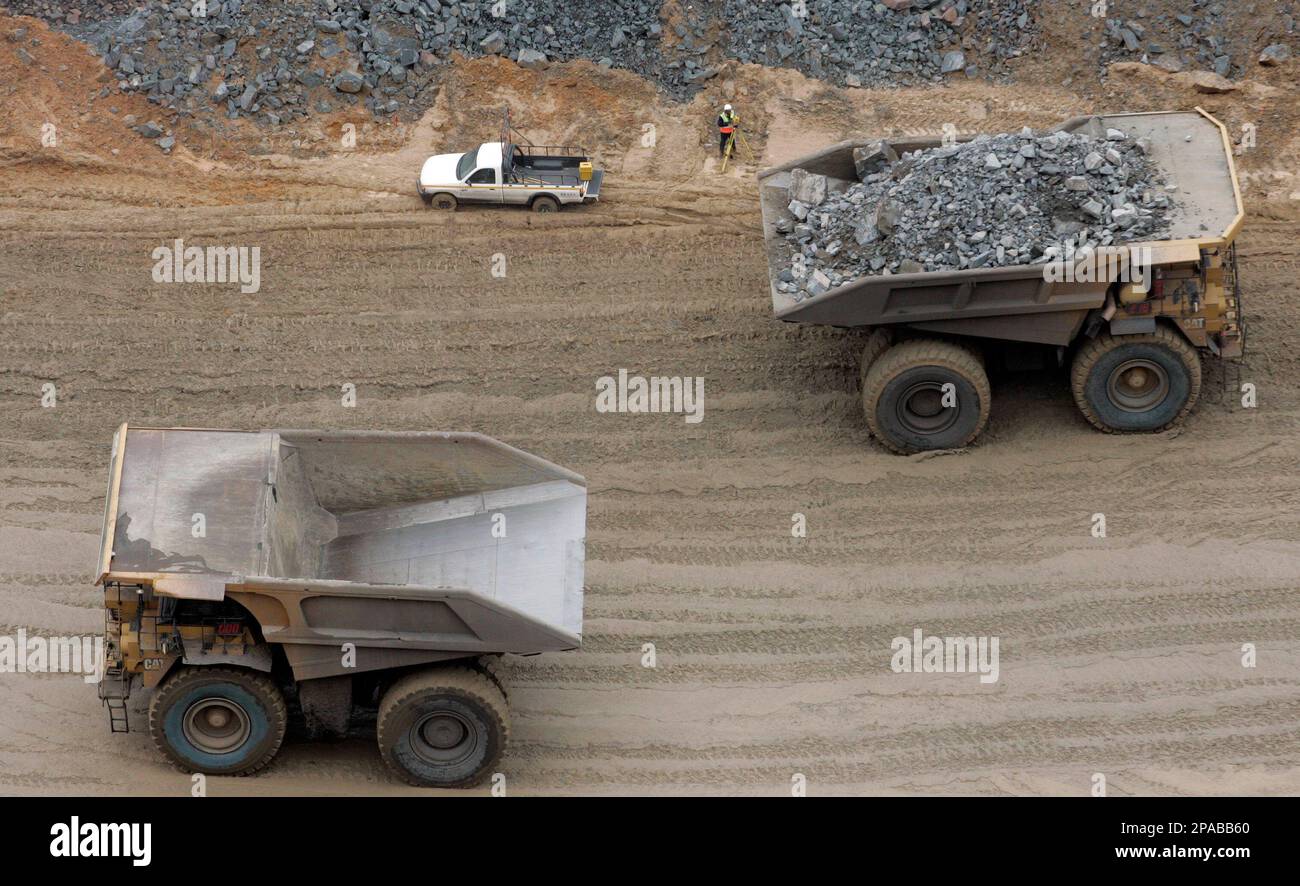 Mine trucks are seen in the open pit at a Debswana mine, a joint ...