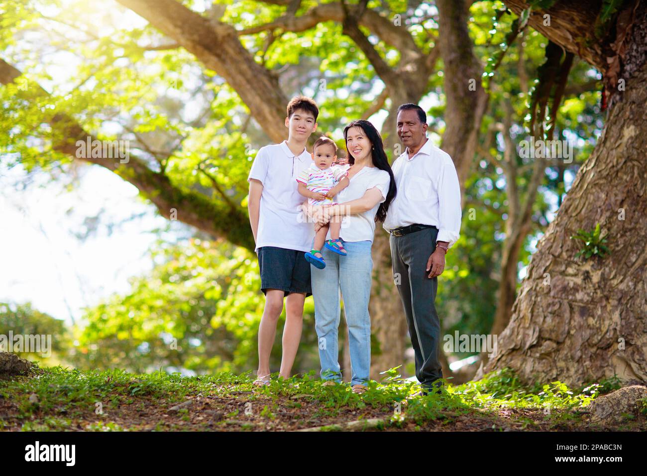 Family walking in summer park. Parents and kids outdoor. Mother, father ...