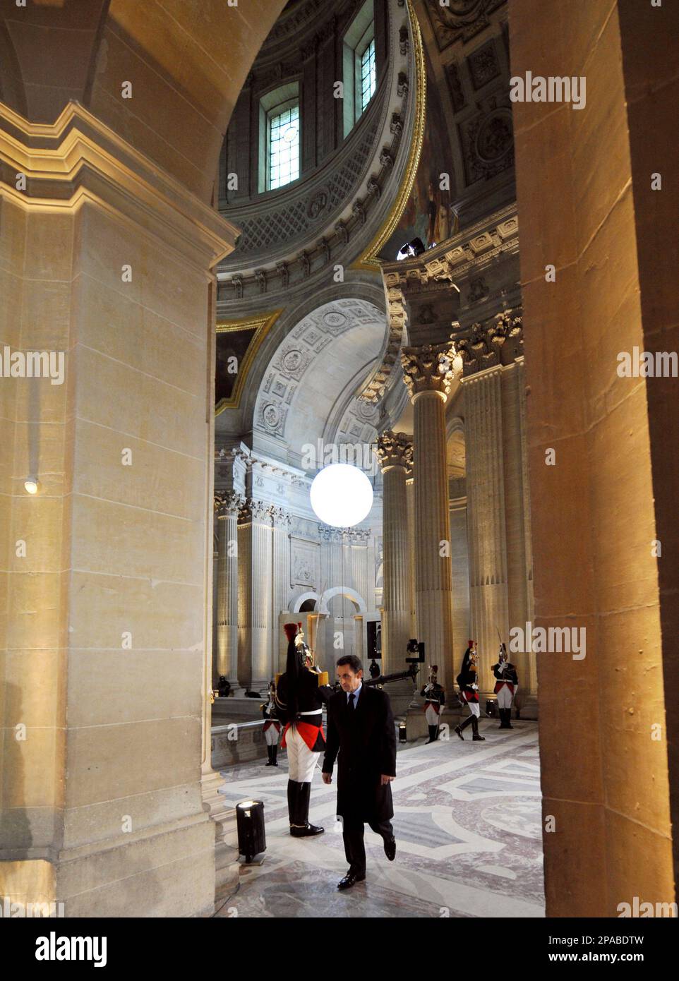 French President Nicolas Sarkozy leaves the Invalides after unveiling a ...