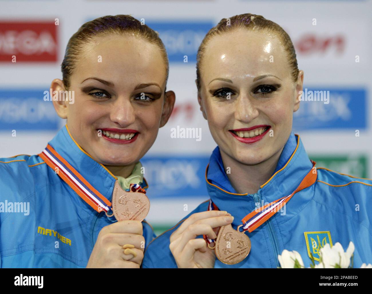 Daria Iushko and Kseniya Sydorenko from Ukraine pose with their medals ...