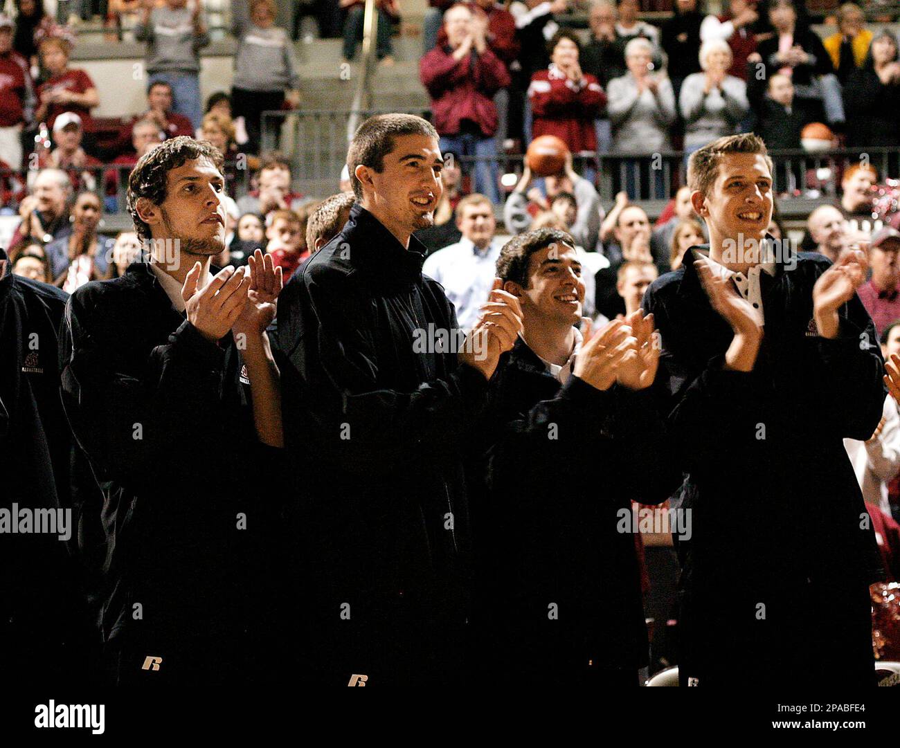 Washington State players, from left, Nikola Koprivica, Daven Harmeling ...