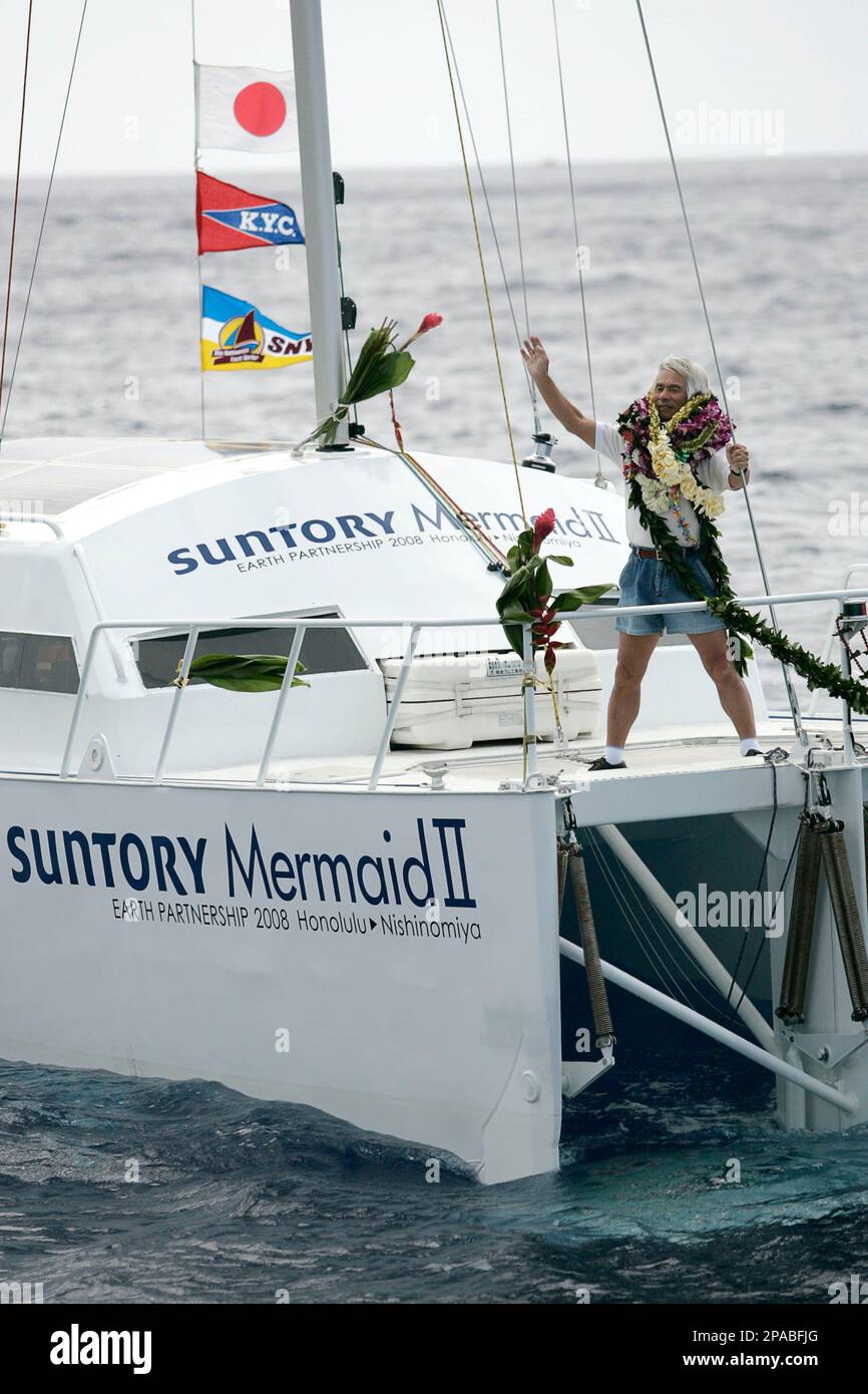 Ken-ichi Horie waves goodbye while aboard his wave powered boat, the ...