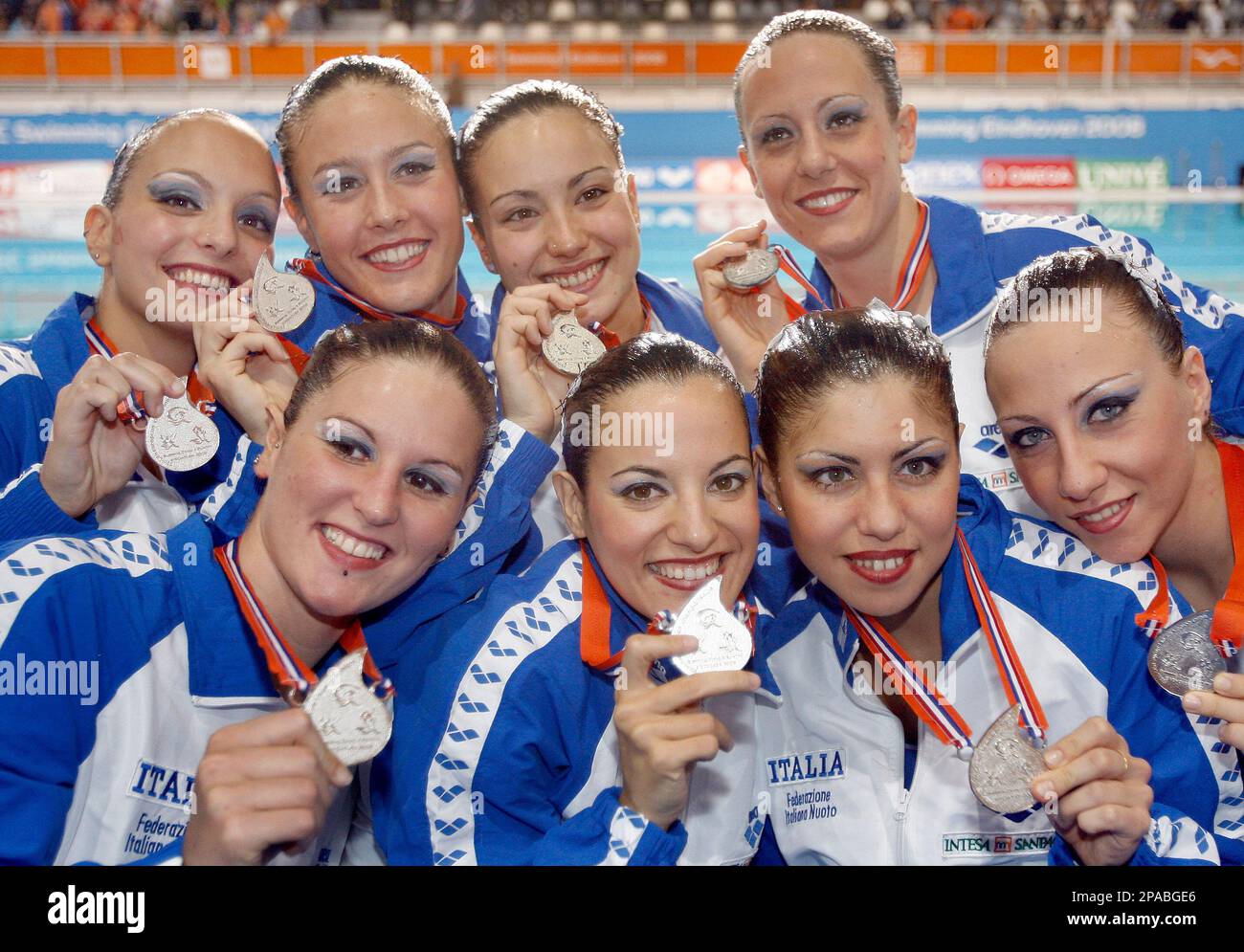 Members of Italy's team pose with their medals after the winning ...