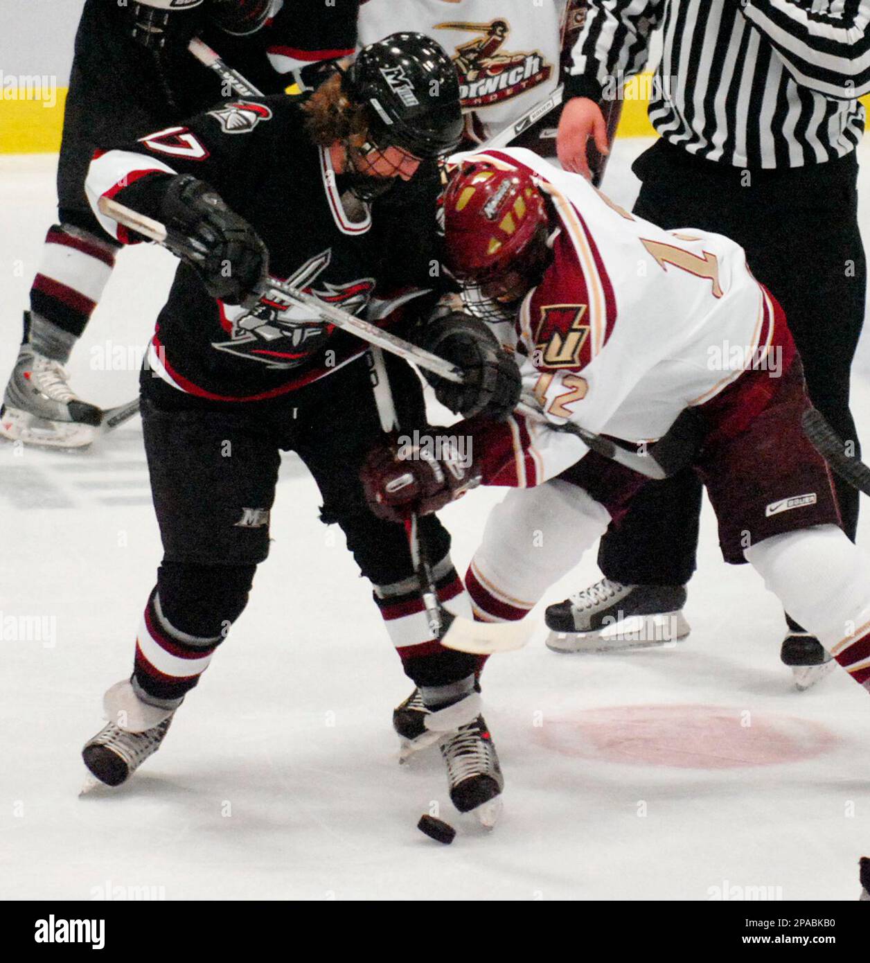 Manhattanville's Dillon Henningson, left, and Norwich's Eric Ouellette ...