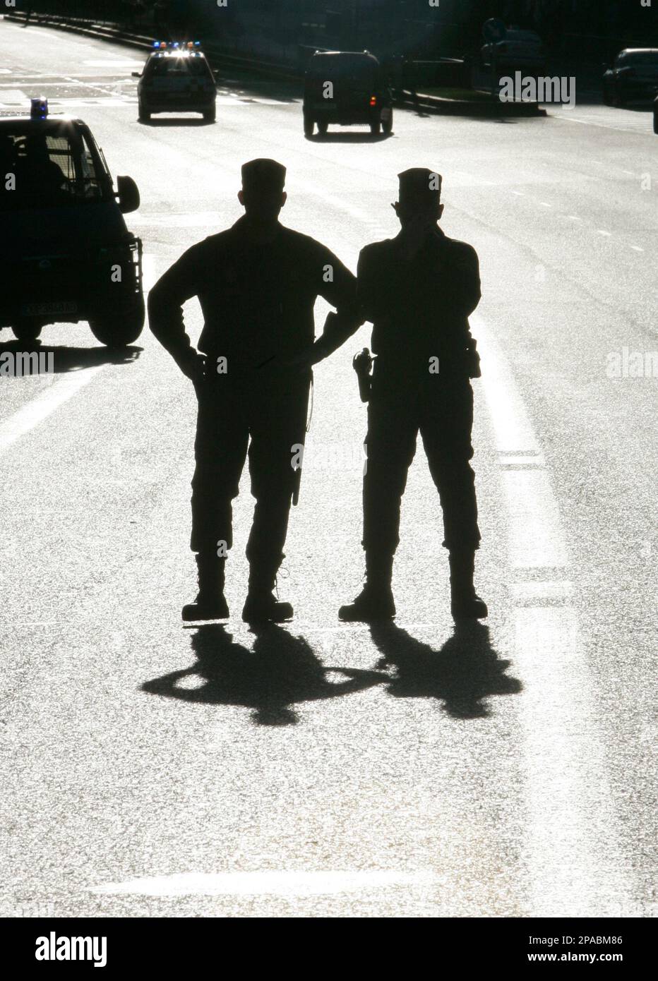 Police keep watch after traffic was cut off in a main street allowing a ...