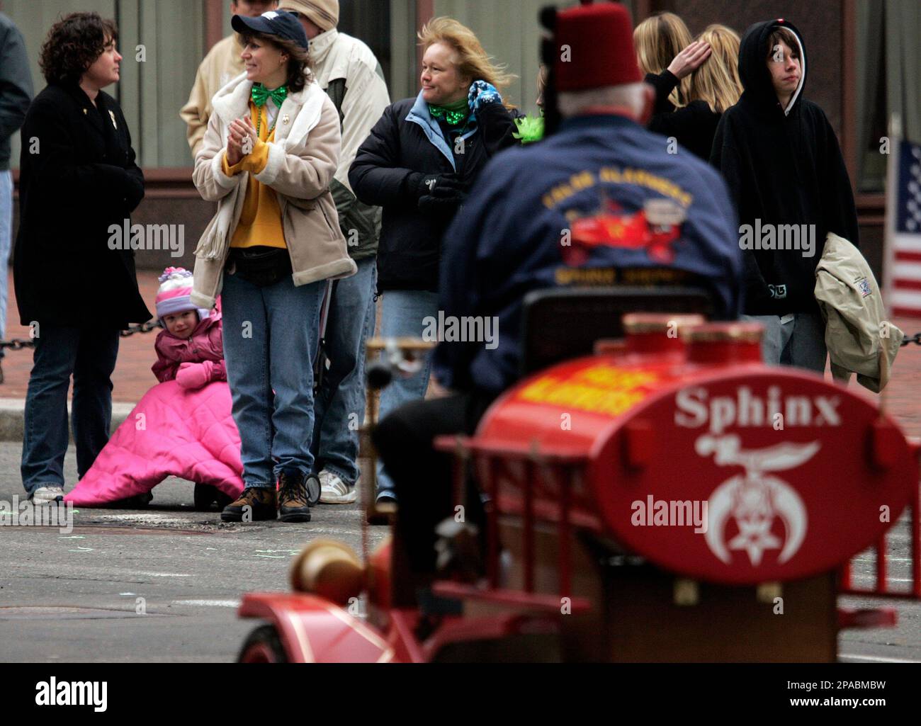 A member of a Shriner's group drives his miniature truck along Main ...