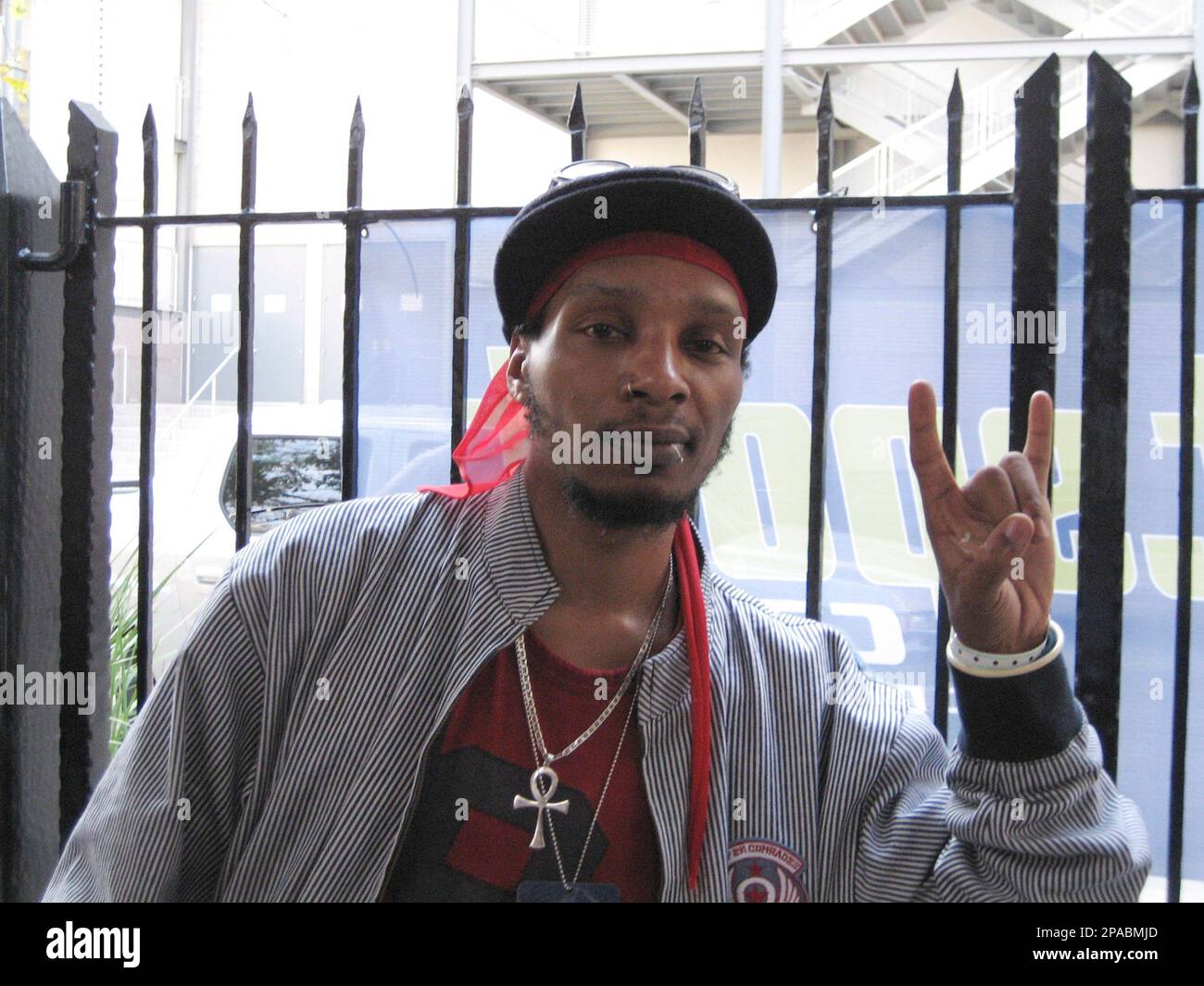 Rapper Del the Funky Homosapien flashes a sign at the EastSport Cafe, a ...