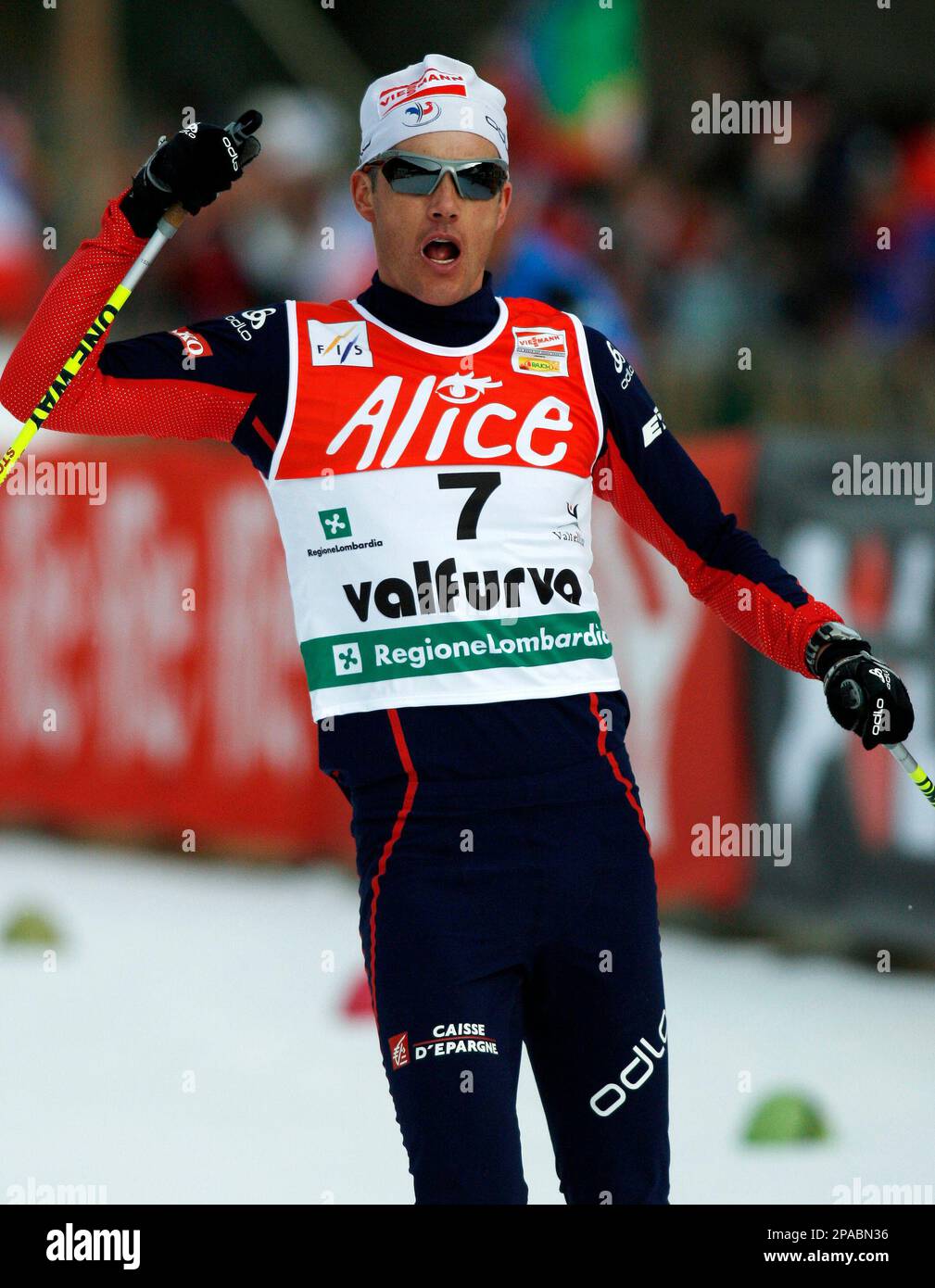 Vincent Vittoz of France reacts as he cuts the finish line to win a ...