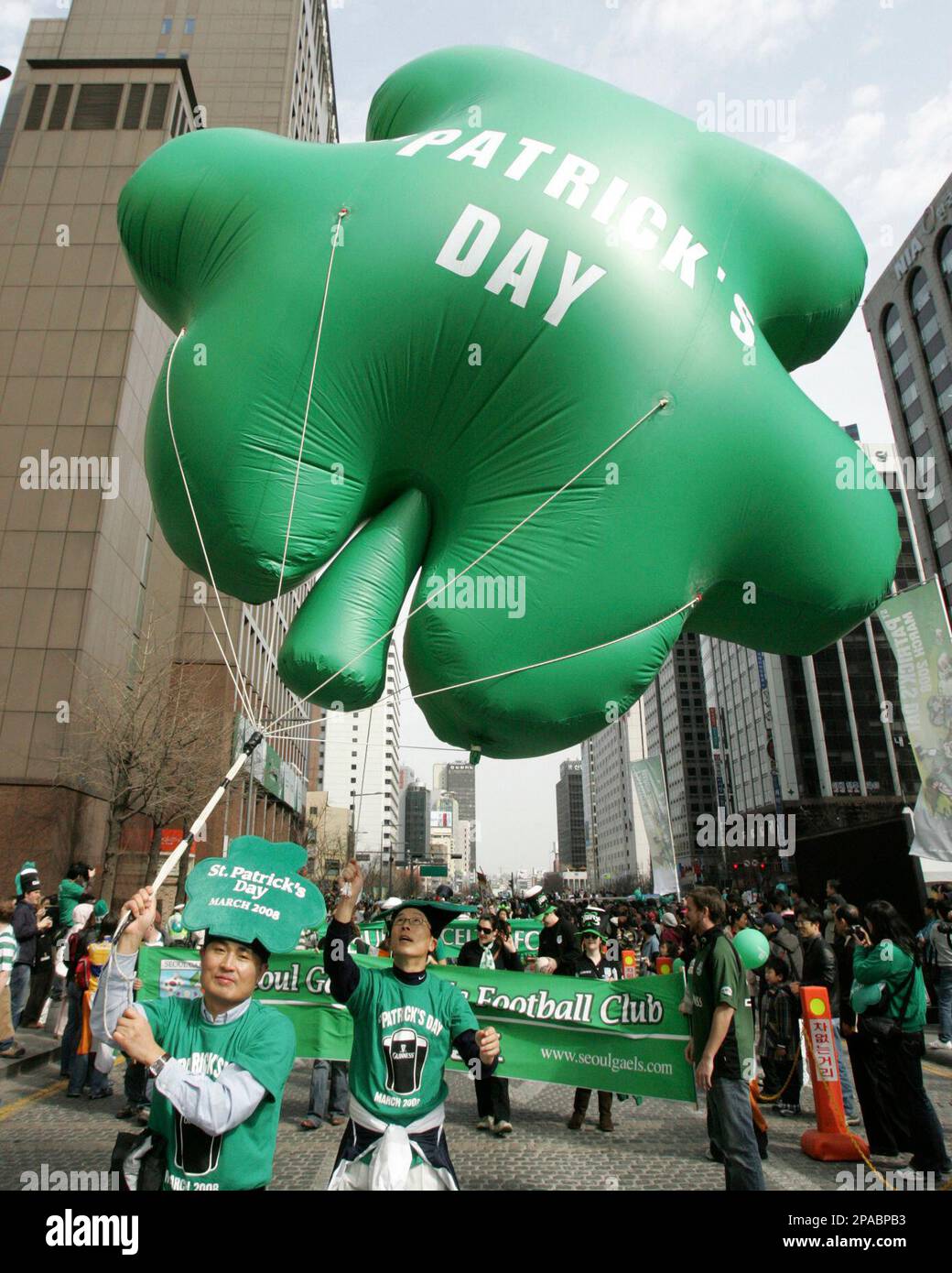 People participate in a parade as part of the St. Patrick's Day ...