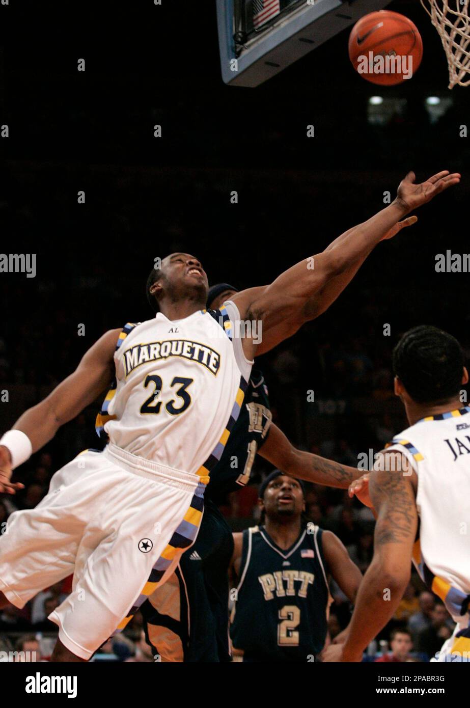Marquette's Wesley Matthews (23) shoots past Pittsburgh's Gilbert Brown ...