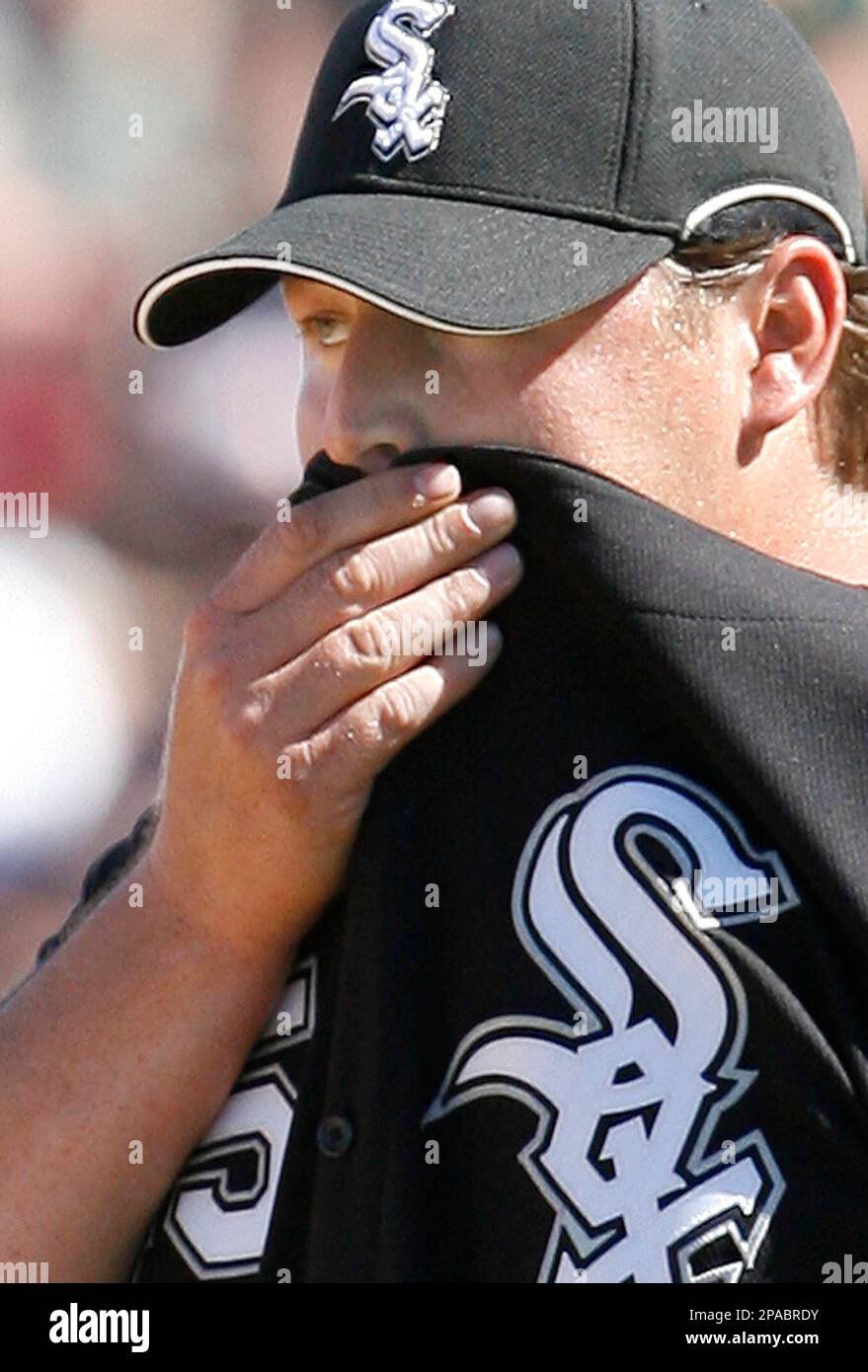 Chicago White Sox pitcher Bobby Jenks wipes his face during the fifth ...