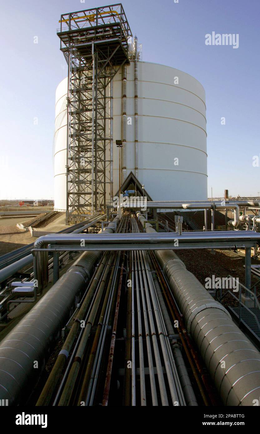 ** FILE ** Pipes carrying liquid natural gas, or LNG, and electrical ...