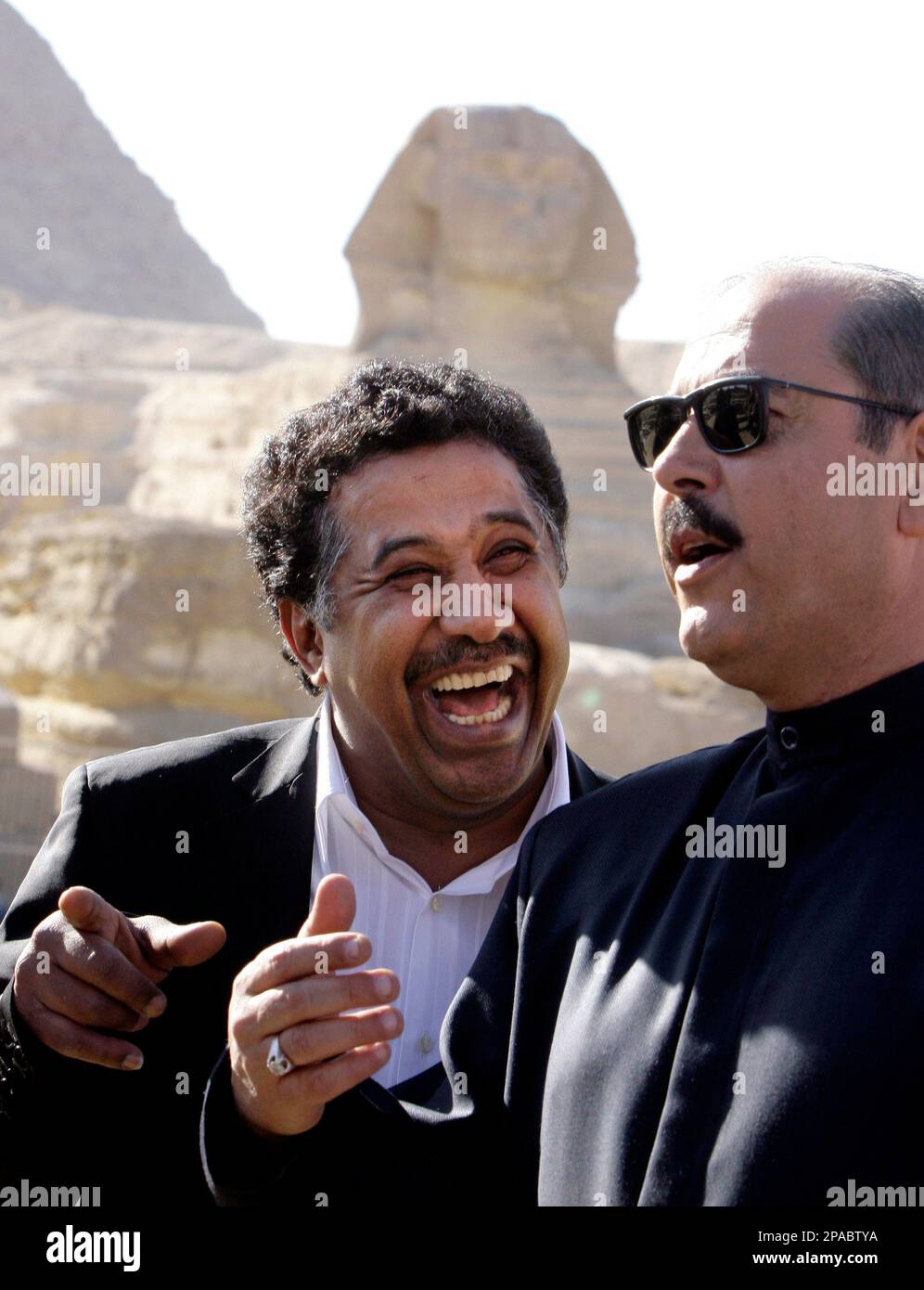 Famous Rai singer Cheb Khaled, left, poses with Tunisian singer Lotfi ...