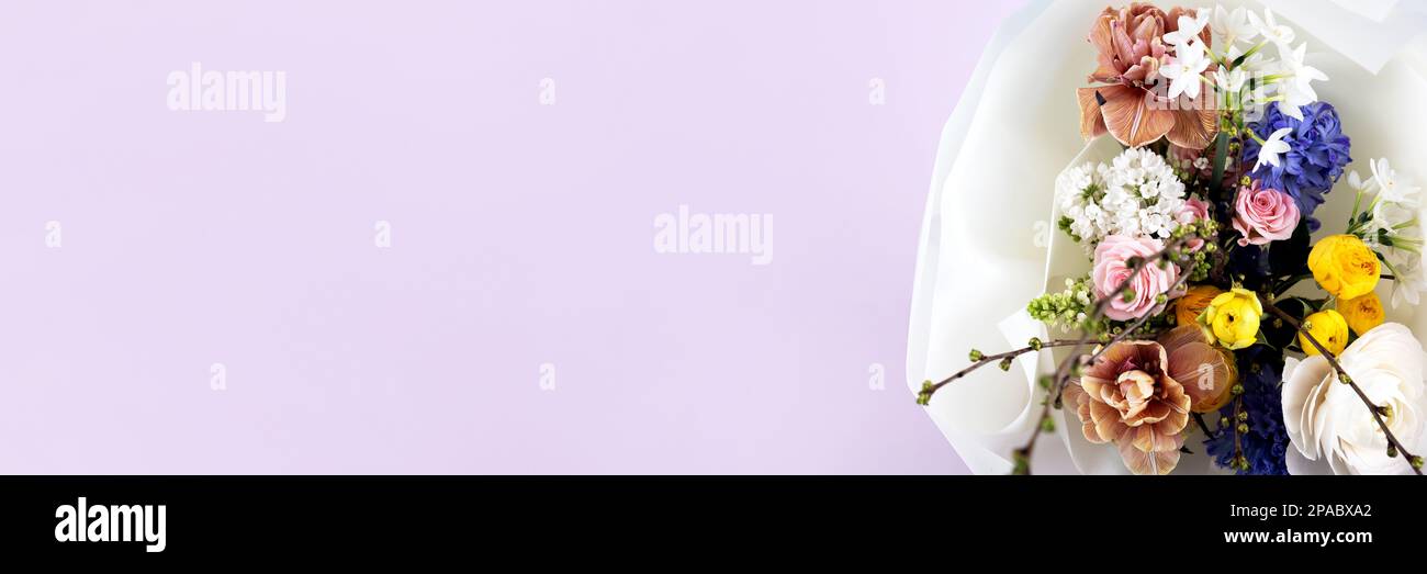 A bright spring bouquet of daffodils, hyacinths, roses, ranunculus ...