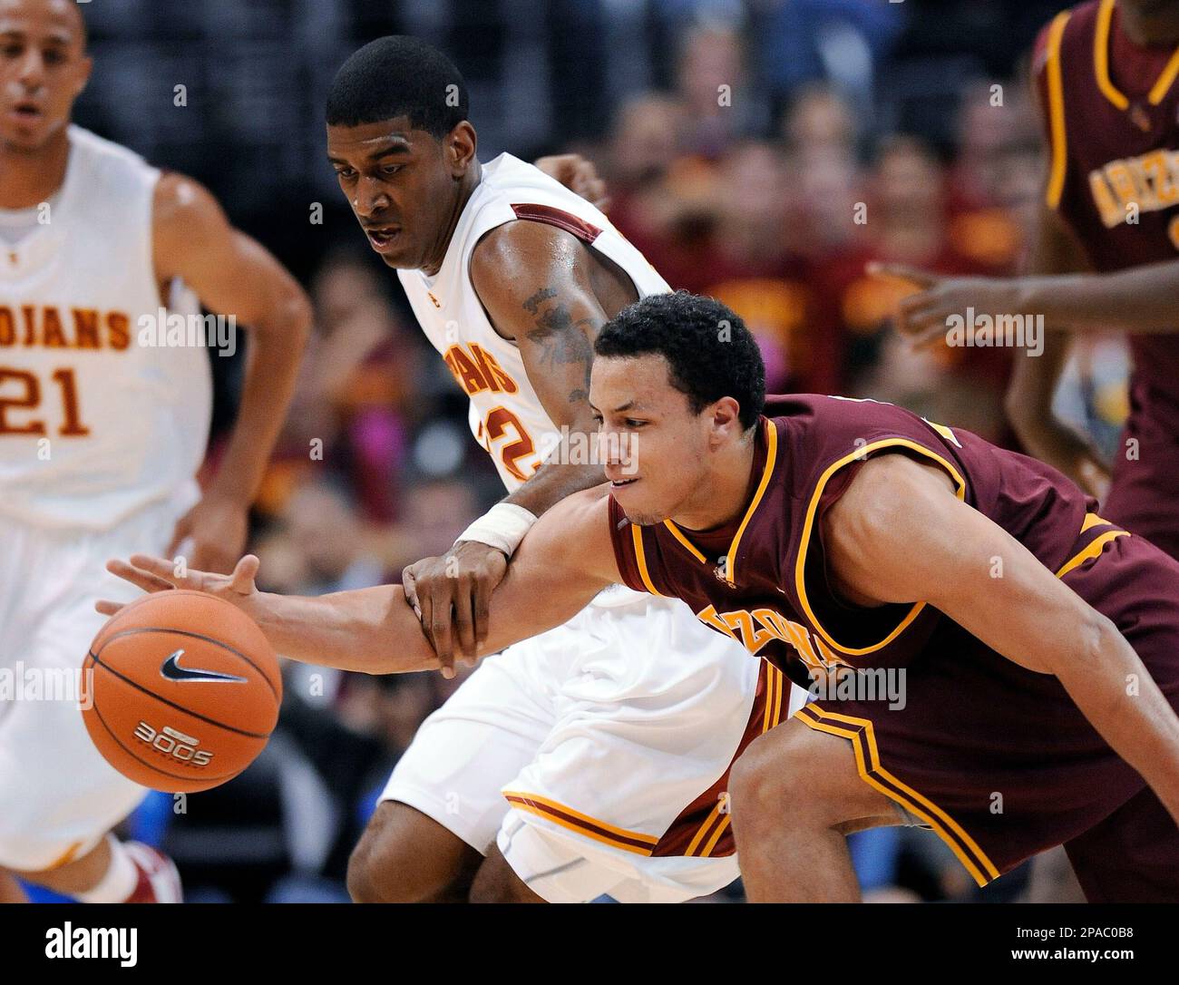 Arizona State's Jerren Shipp, right, has the ball striped from his ...