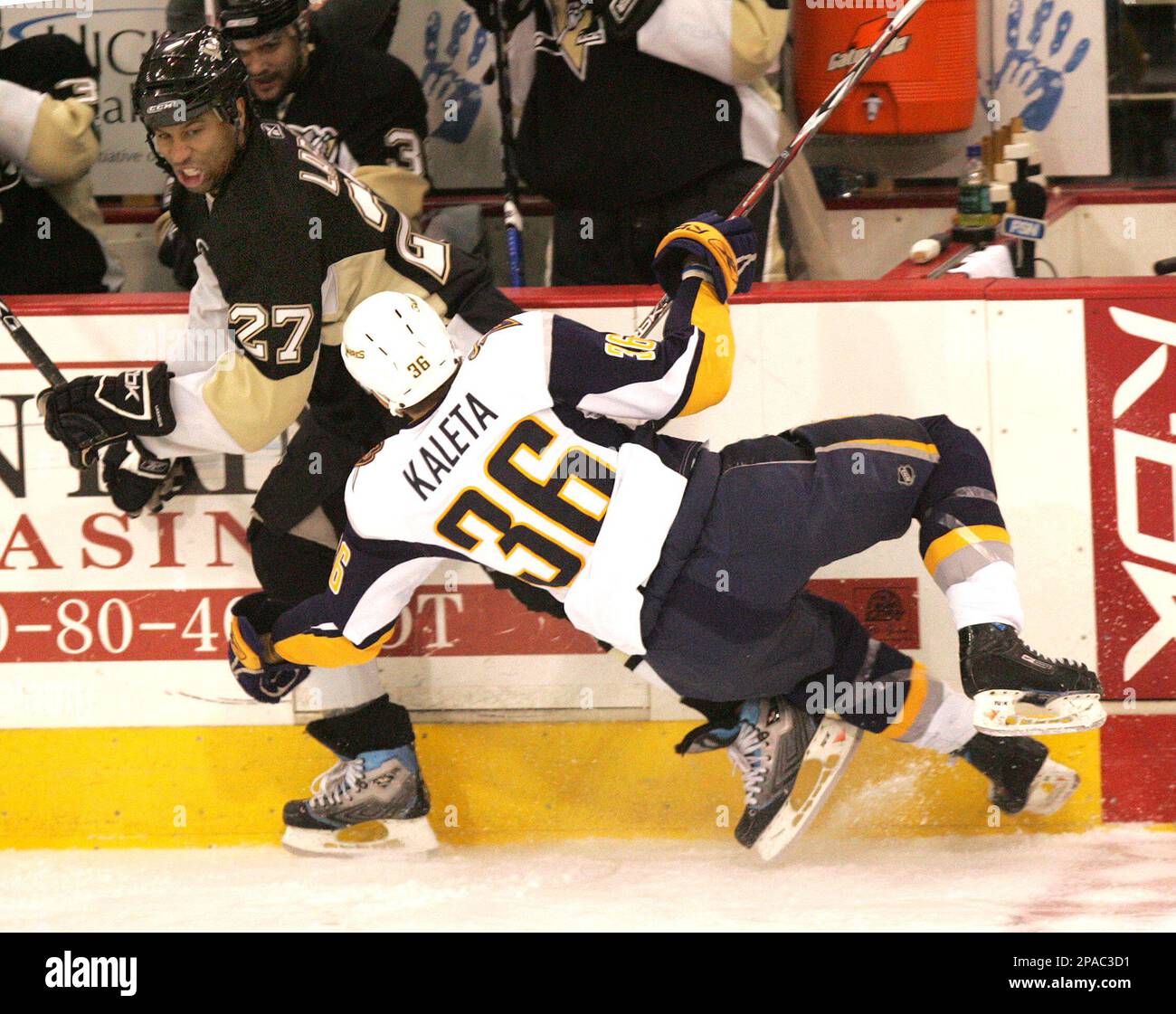 Buffalo Sabres' Patrick Kaleta, right, is upended as he is checked by ...