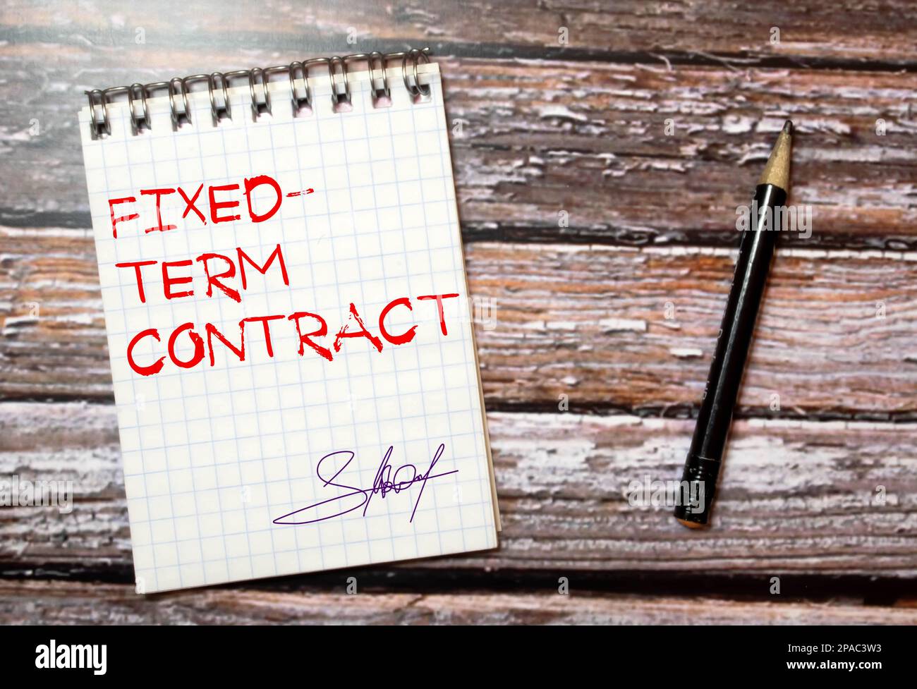 Top view clock and miniature people with text Fixed-Term Contract on a ...