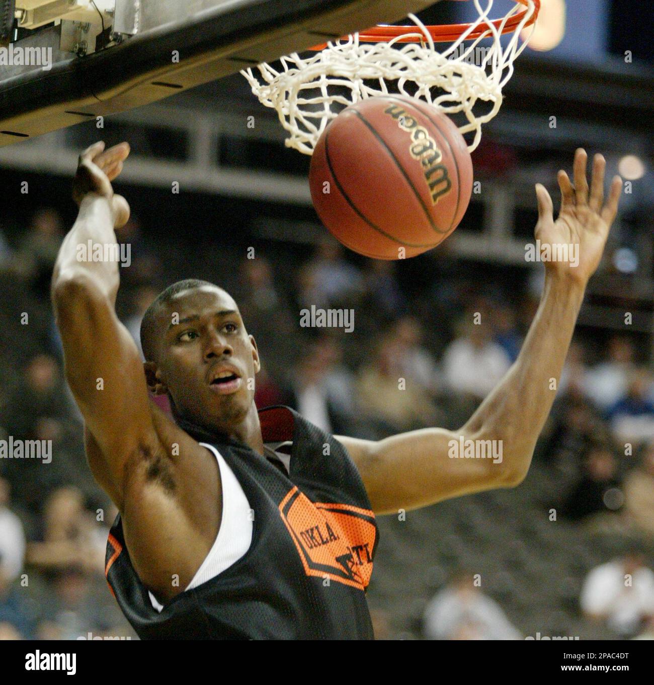 Oklahoma State guard Terrel Harris dunks the ball during practice for ...