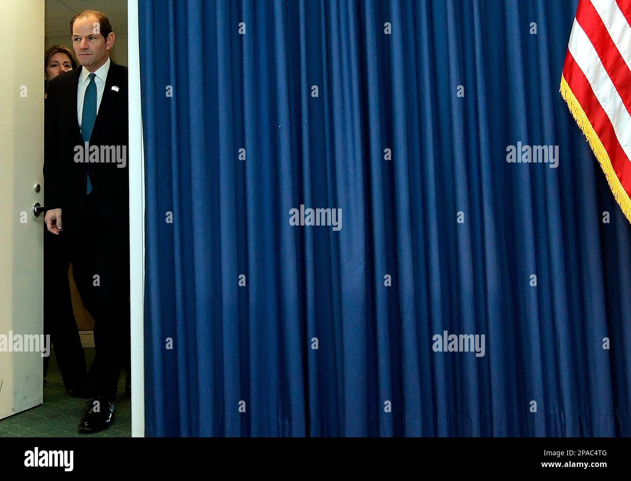 New York Gov. Eliot Spitzer trailed by his wife Silda enters a news ...