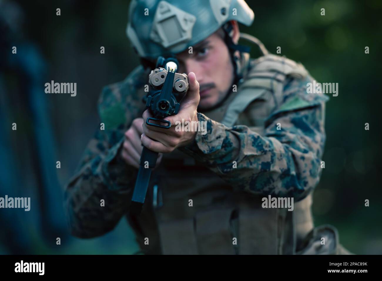 A modern warfare soldier on war duty in dense and dangerous forest ...