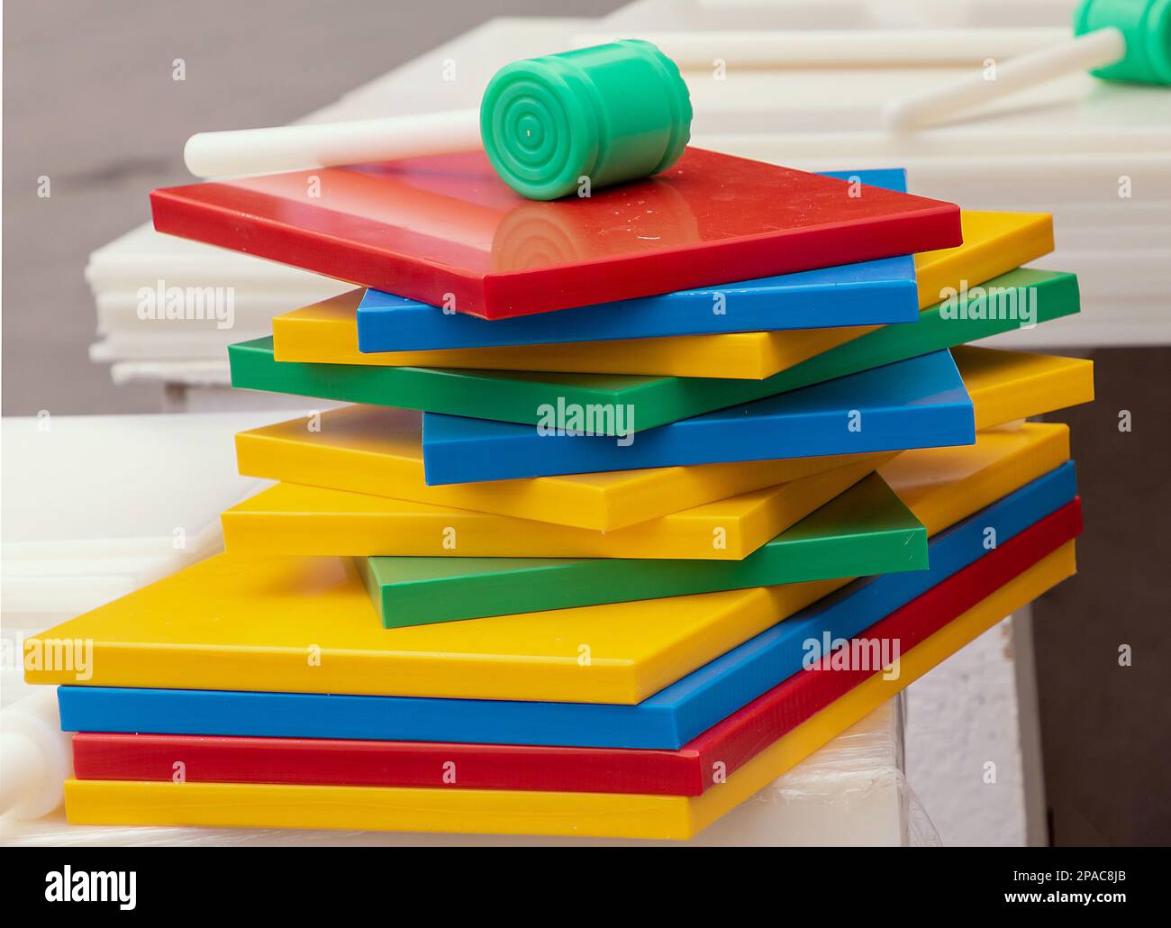 Pile of colour coded colorful plastic chopping boards sold on market ...